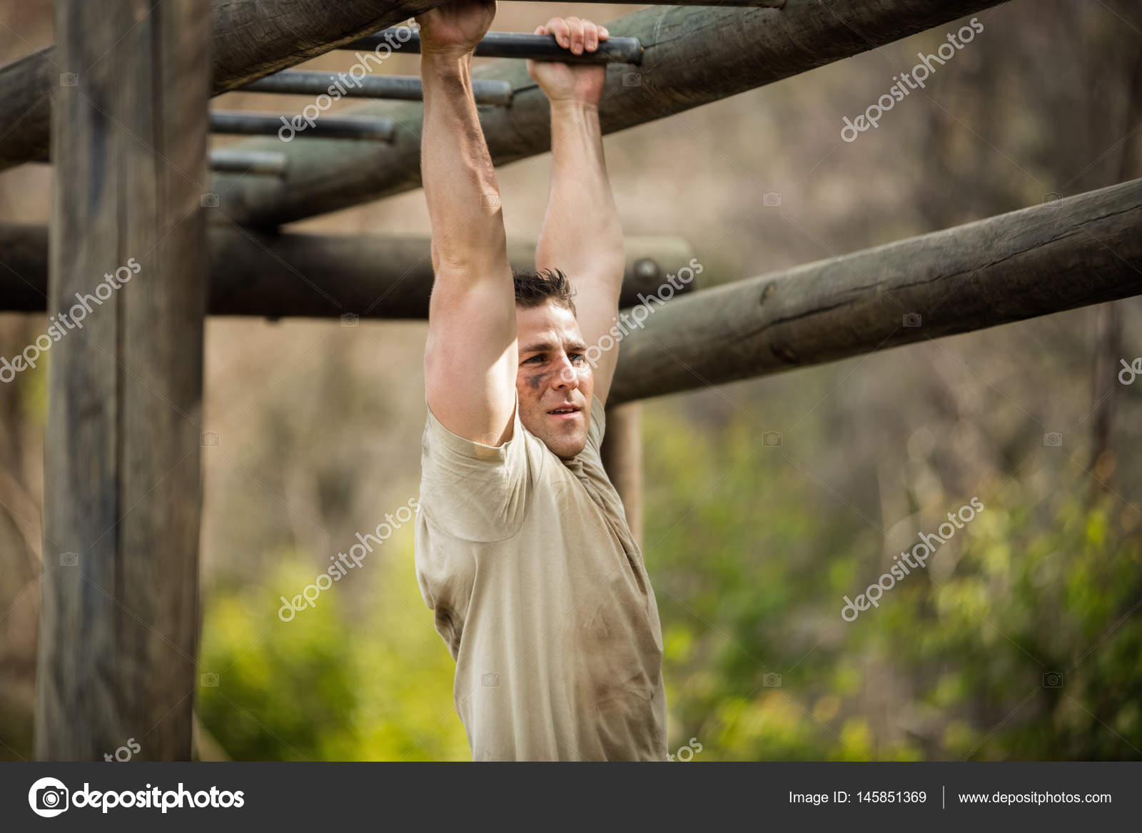 Soldier climbing monkey bars — Stock Photo © Wavebreakmedia #145851369