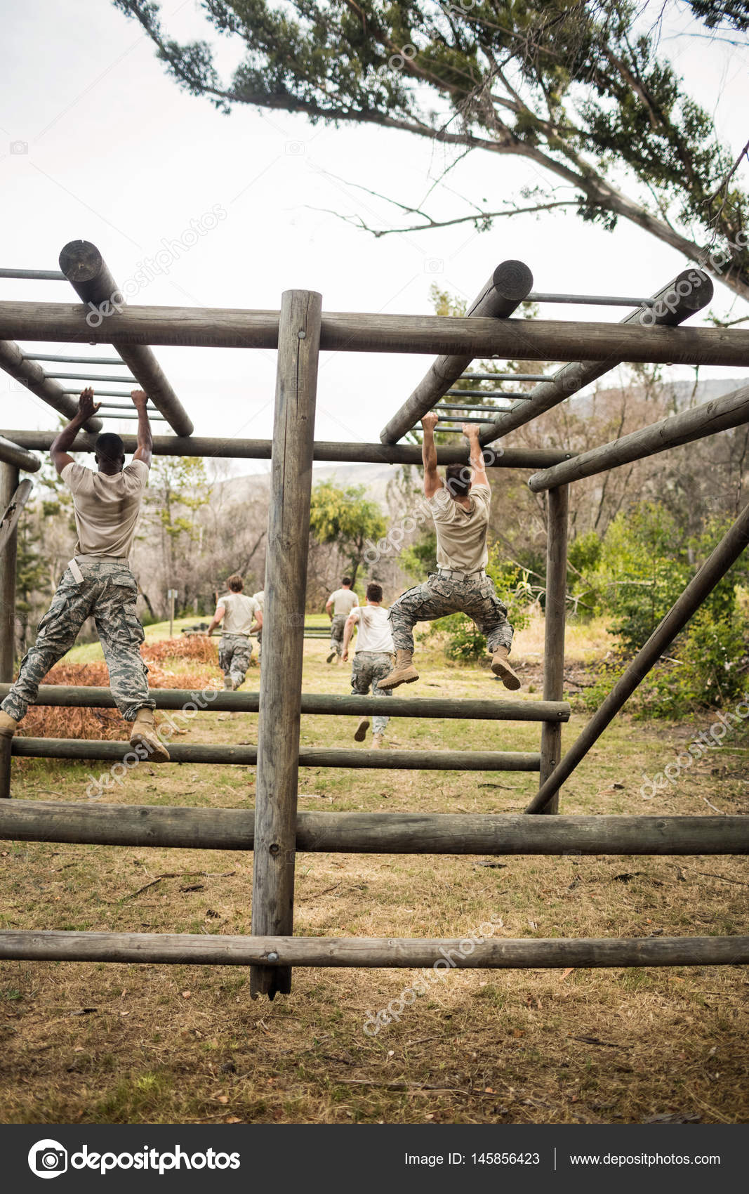 Soldiers climbing monkey bars — Stock Photo © Wavebreakmedia #145856423
