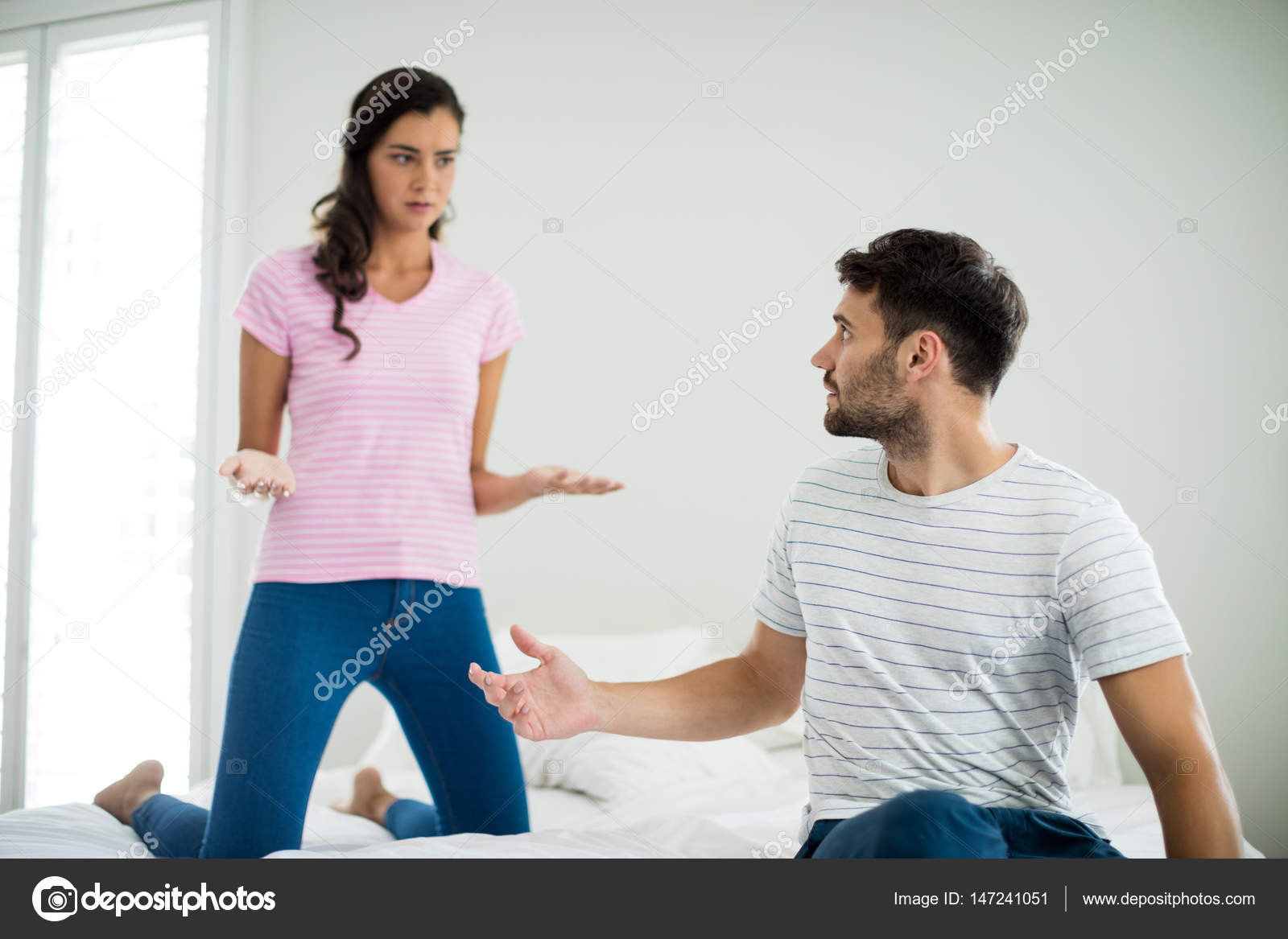 Couple arguing with each other in bedroom Stock Photo by ...