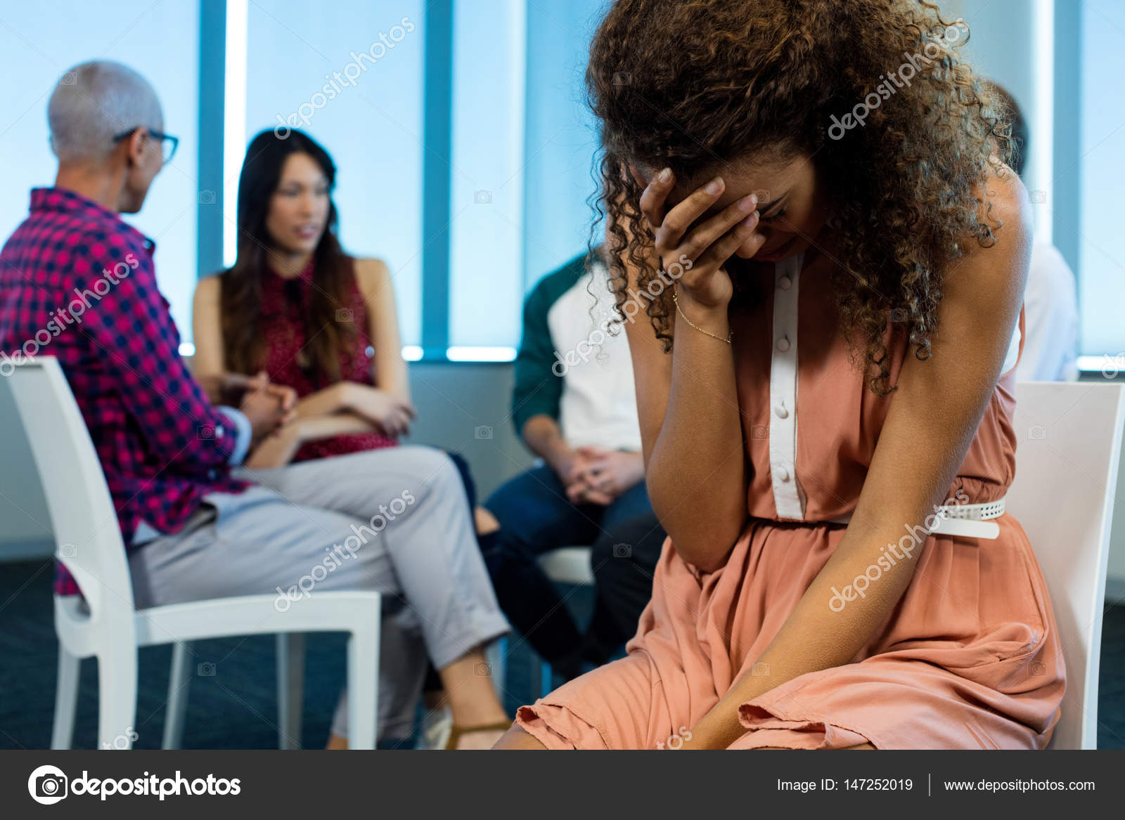 Woman crying while creative business team in background — Stock Photo ...
