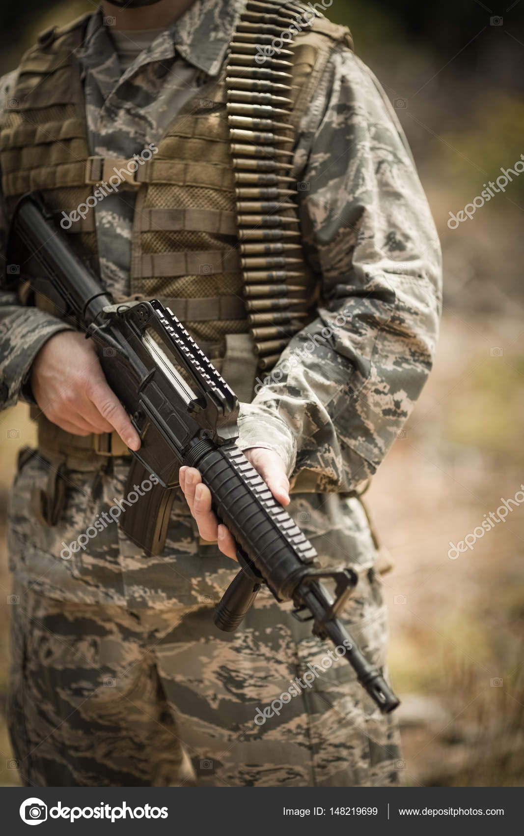 Military soldier holding a rifle — Stock Photo © Wavebreakmedia #148219699