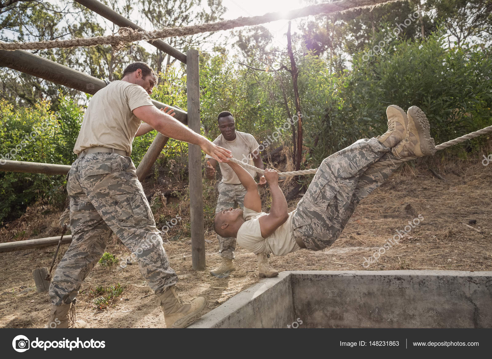 Military soldiers practicing rope climbing Stock Photo by ...