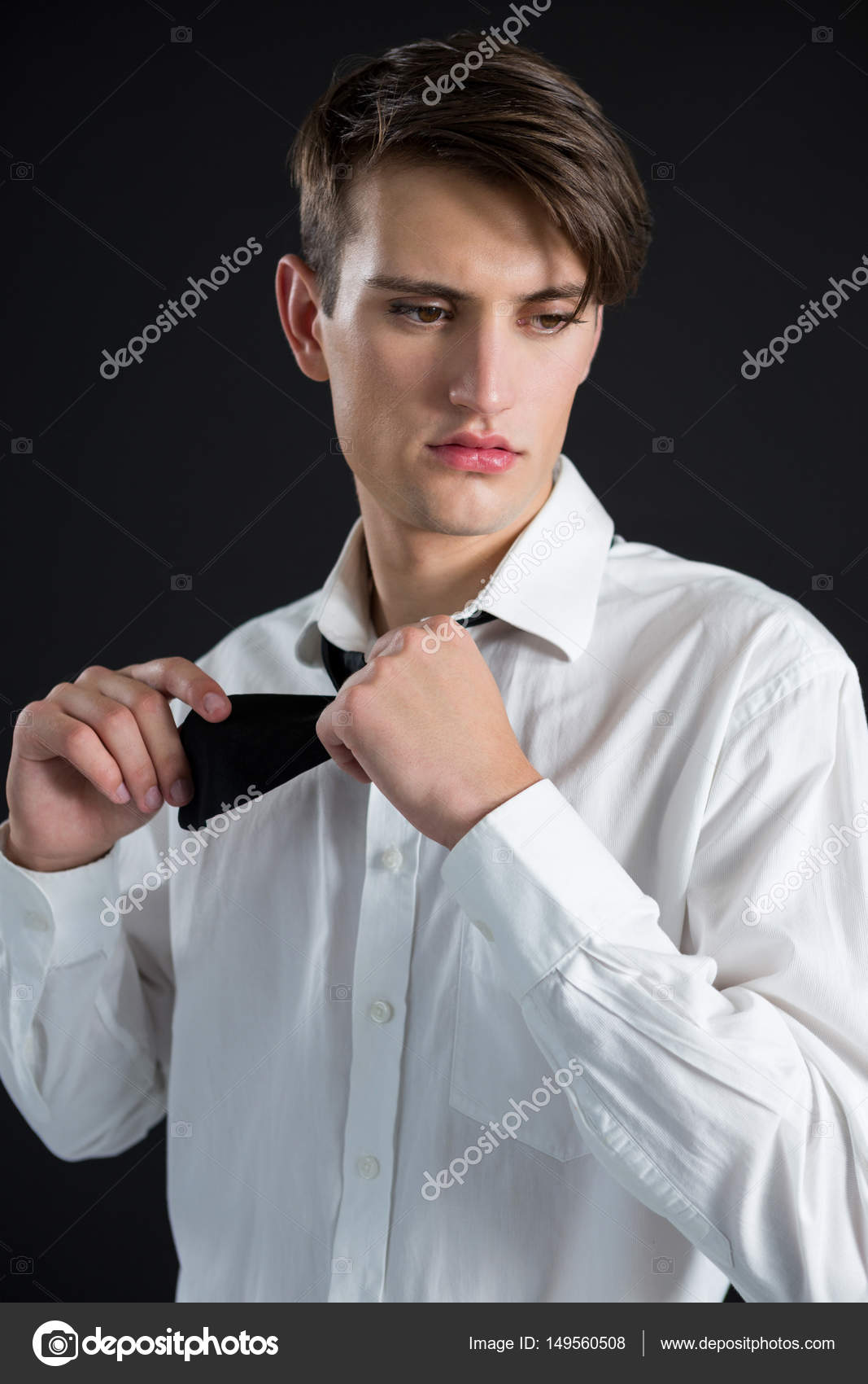 Androgynous man posing against black background Stock Photo by ...