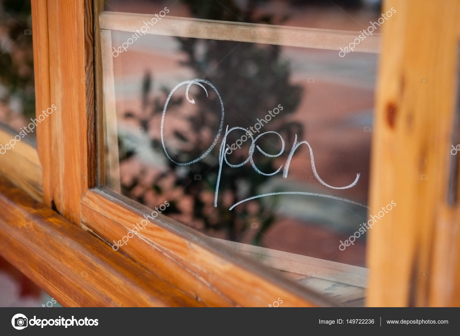 Open text on glass window Stock Photo by ©Wavebreakmedia 149722236