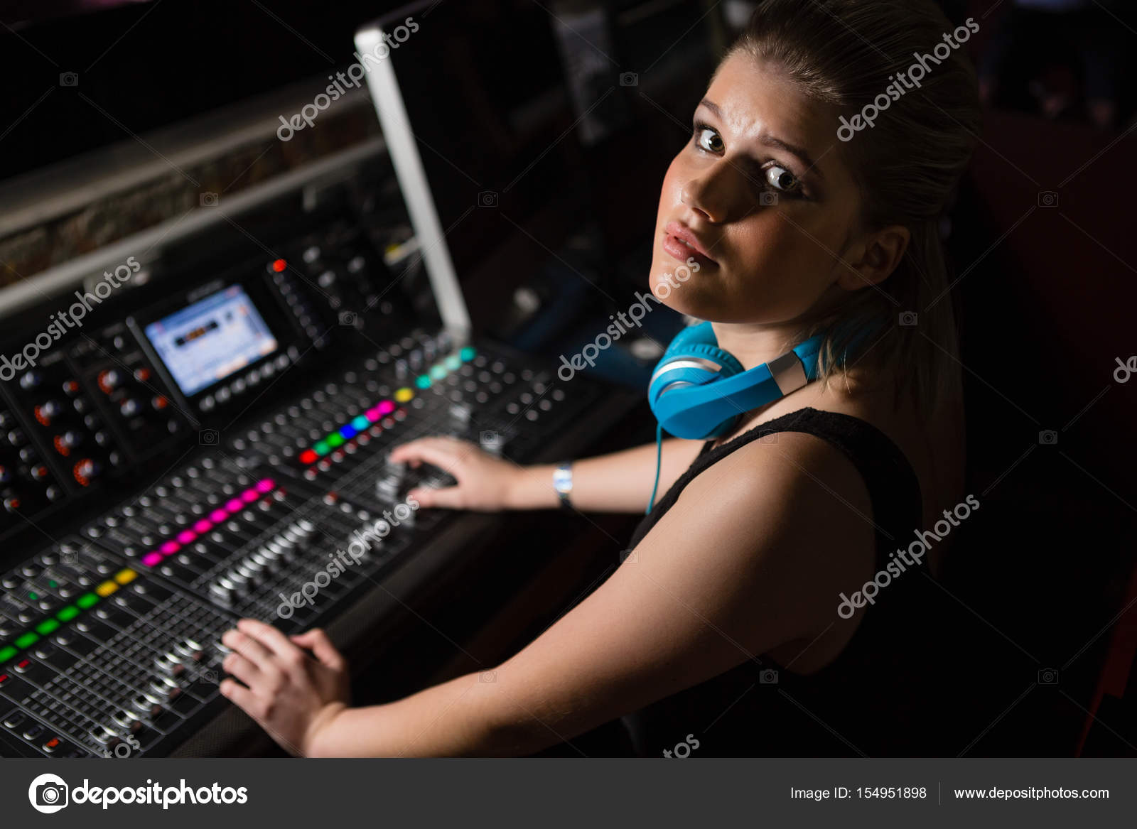 Female audio engineer using sound mixer — Stock Photo © Wavebreakmedia ...