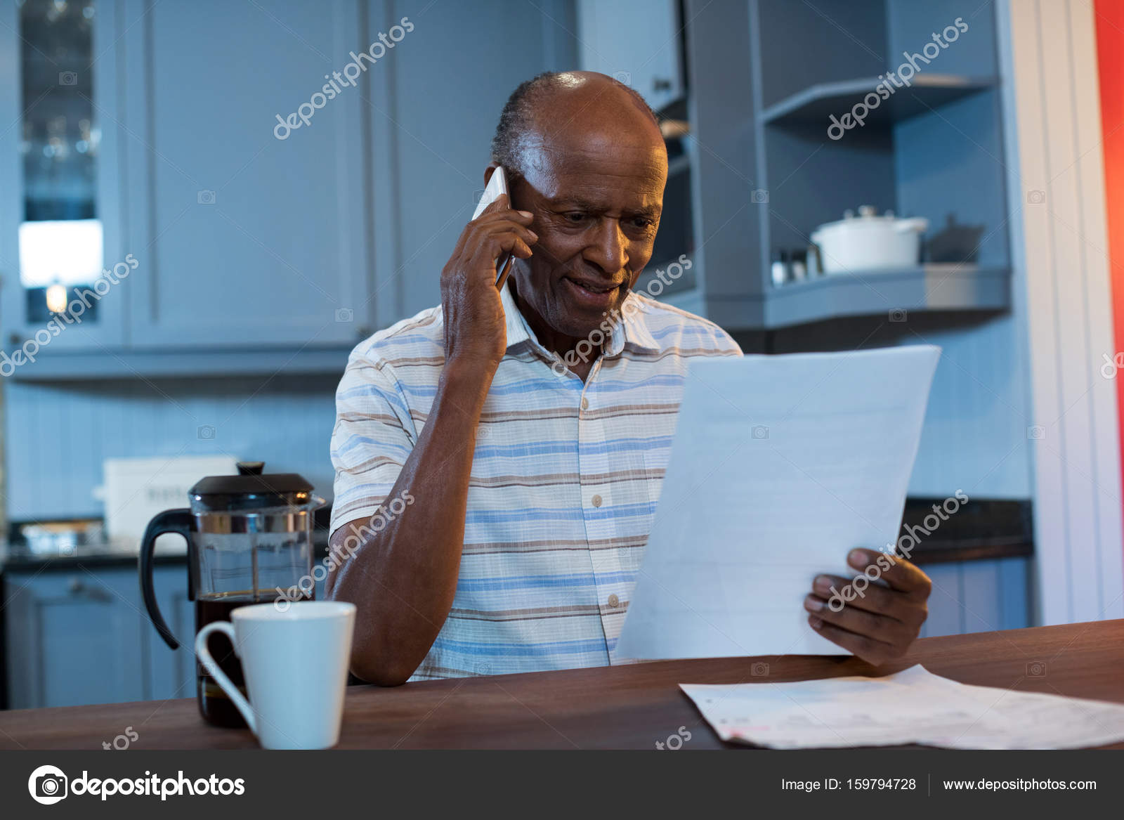 Man reading document walking talking on phone Stock Photo by ...