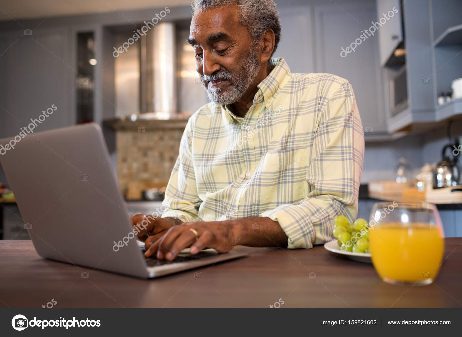 Smiling man using laptop Stock Photo by ©Wavebreakmedia 159821602 Smiling man using laptop Stock Photo by ©Wavebreakmedia 159821602
