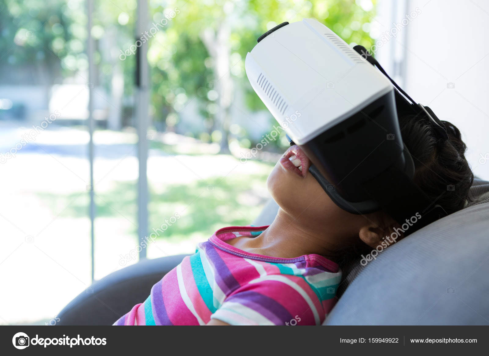 Girl wearing virtual reality simulator Stock Photo by ©Wavebreakmedia ...