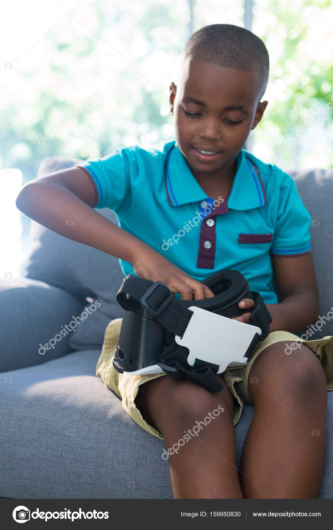 Boy adjusting virtual reality headset Stock Photo by ©Wavebreakmedia ...