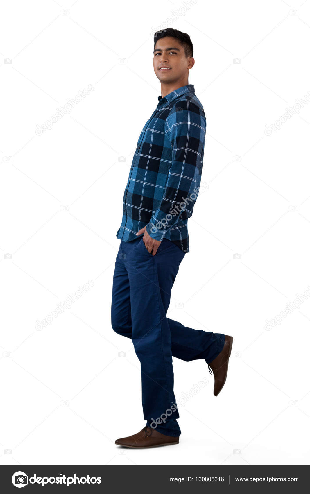 Man with hands in pockets standing on one leg — Stock Photo ...