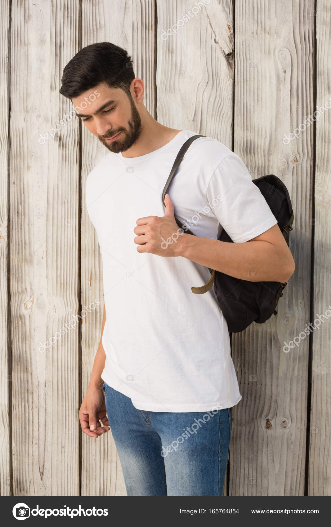 Man posing against wooden background — Stock Photo © Wavebreakmedia ...