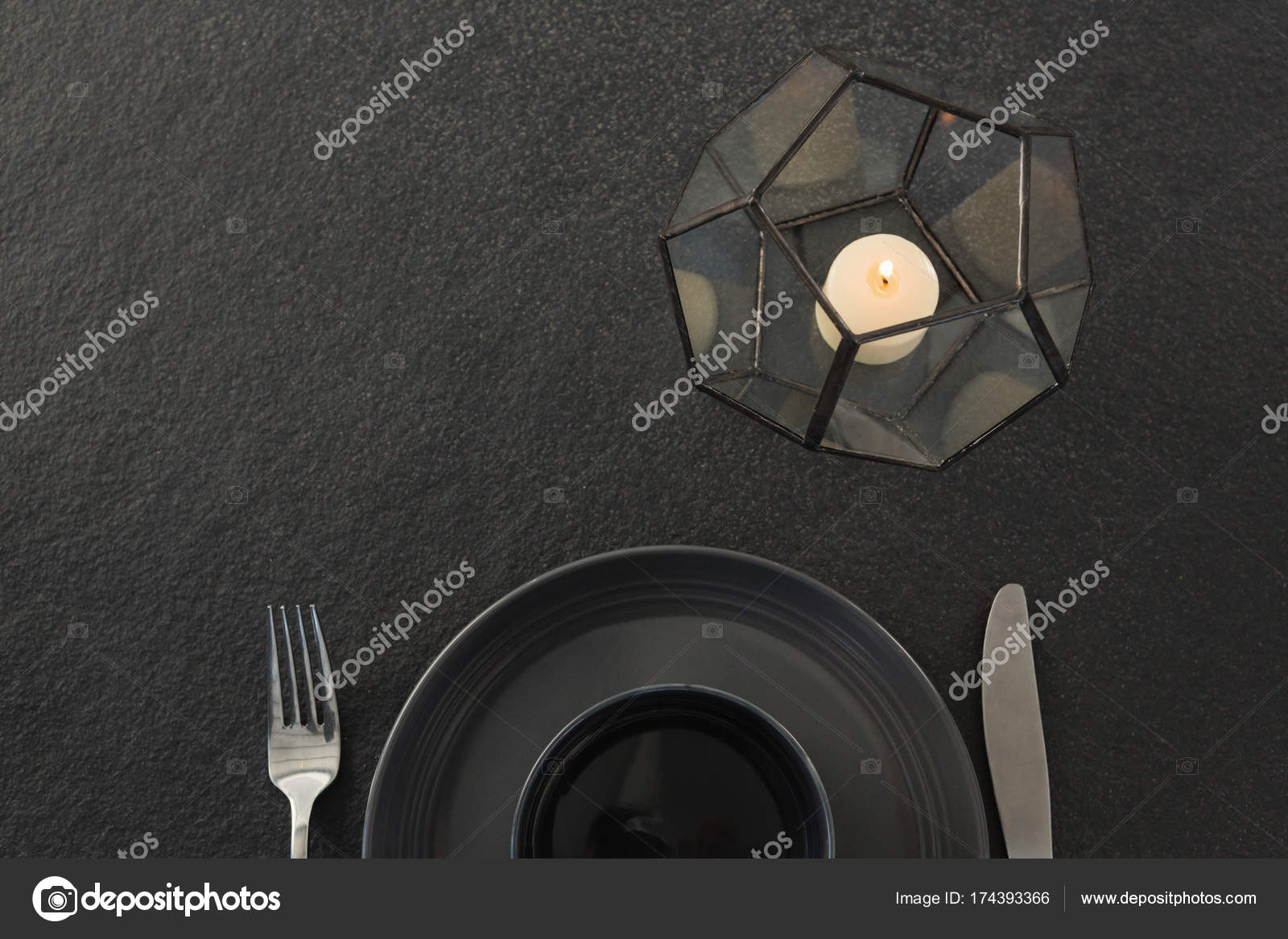 Black theme table setting Stock Photo by ©Wavebreakmedia 174393366