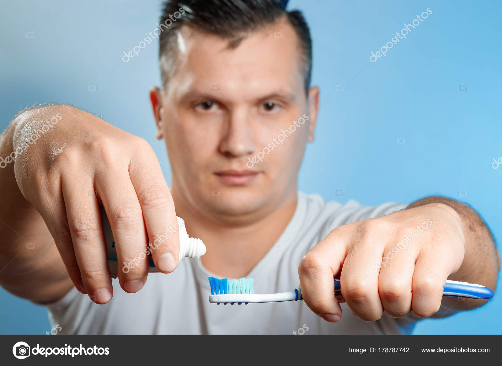 Close Attractive Young Man Brushing His Teeth Man Squeezes Toothpaste ...
