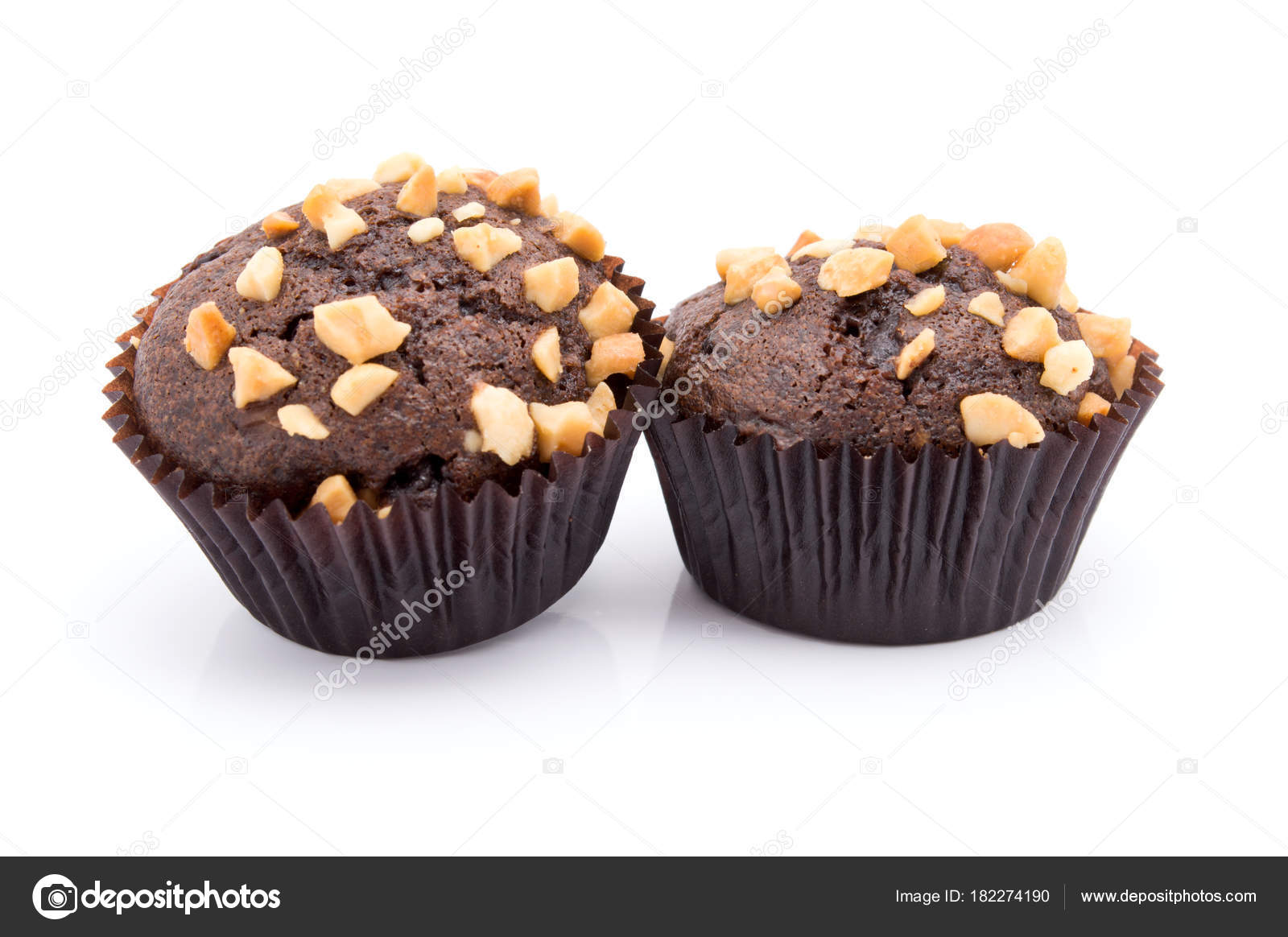 Group of chocolate muffins with nuts crumbs isolated on white ...