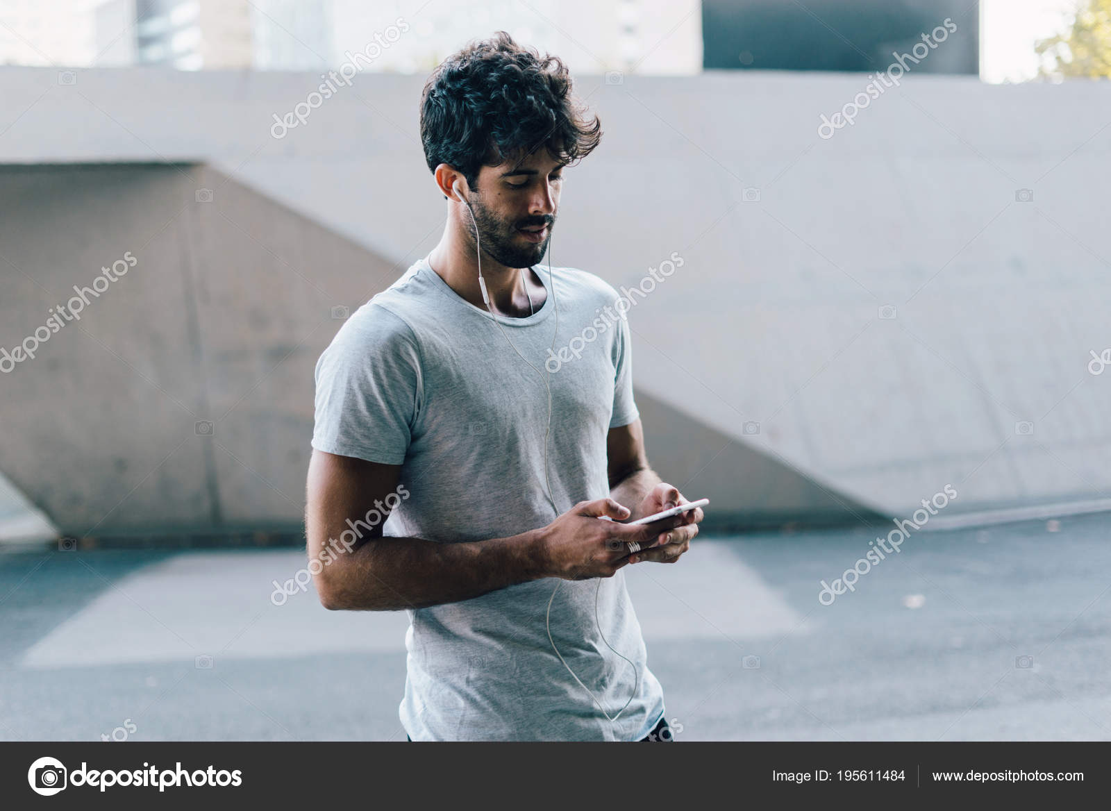 Handsome Young Man Smartphone Posing Outdoors — Stock Photo © Jkstock ...