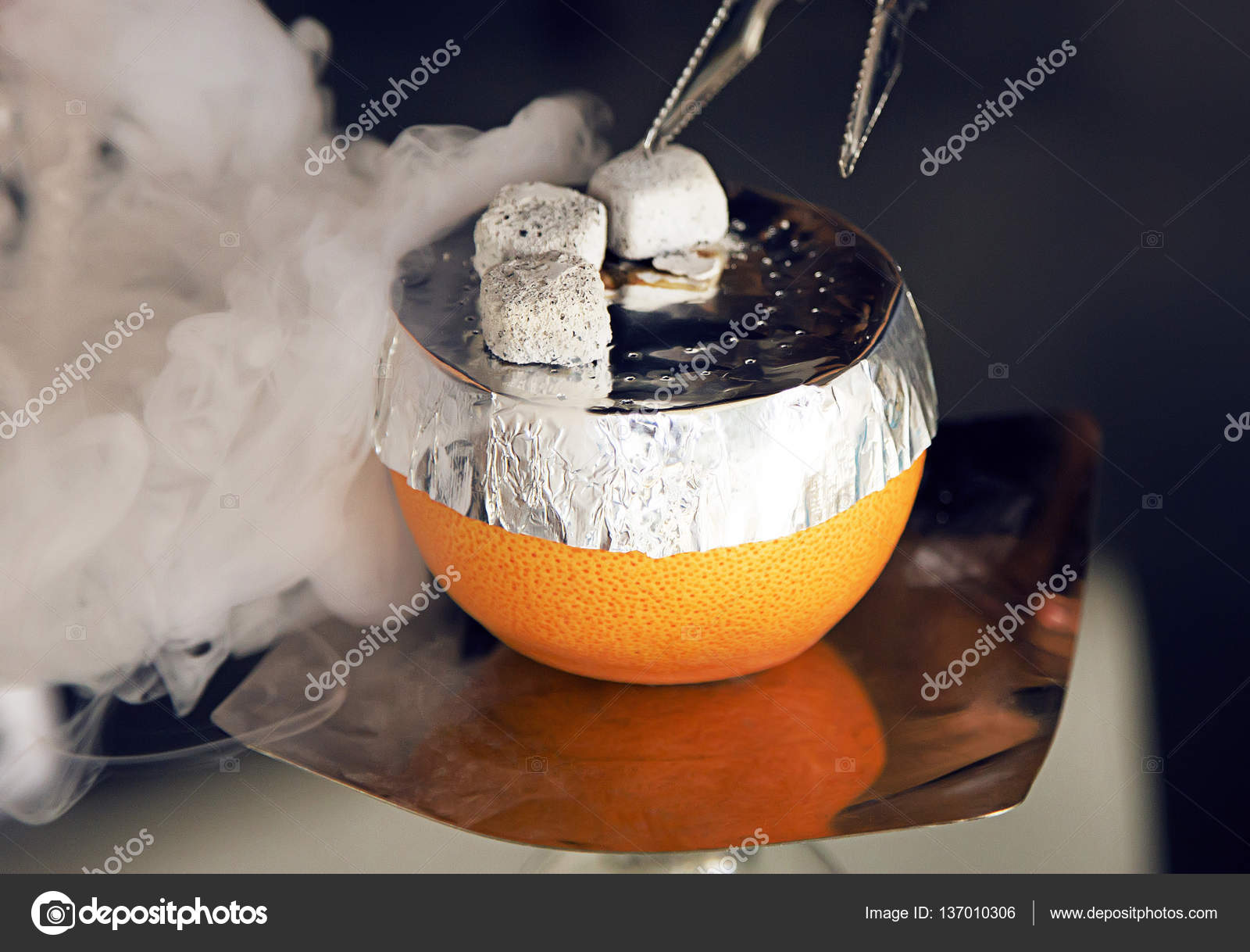 Hookah with orange bowl and hookah coals Stock Photo by ©LiljaMalanjak 137010306