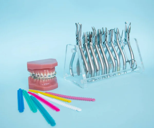 Metal braces for teeth and tools for correction of brace systems ...