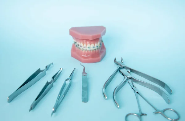 Metal braces for teeth and tools for correction of brace systems ...