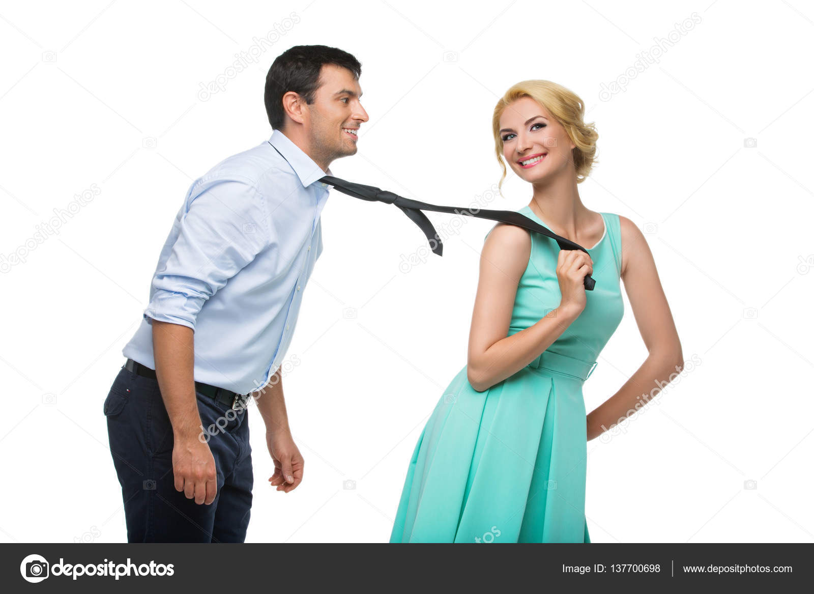 Woman pulling man for his tie — Stock Photo © Svetography #137700698