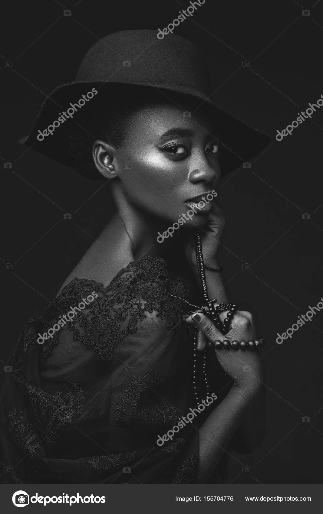 Beautiful girl in black hat — Stock Photo © Svetography #155704776