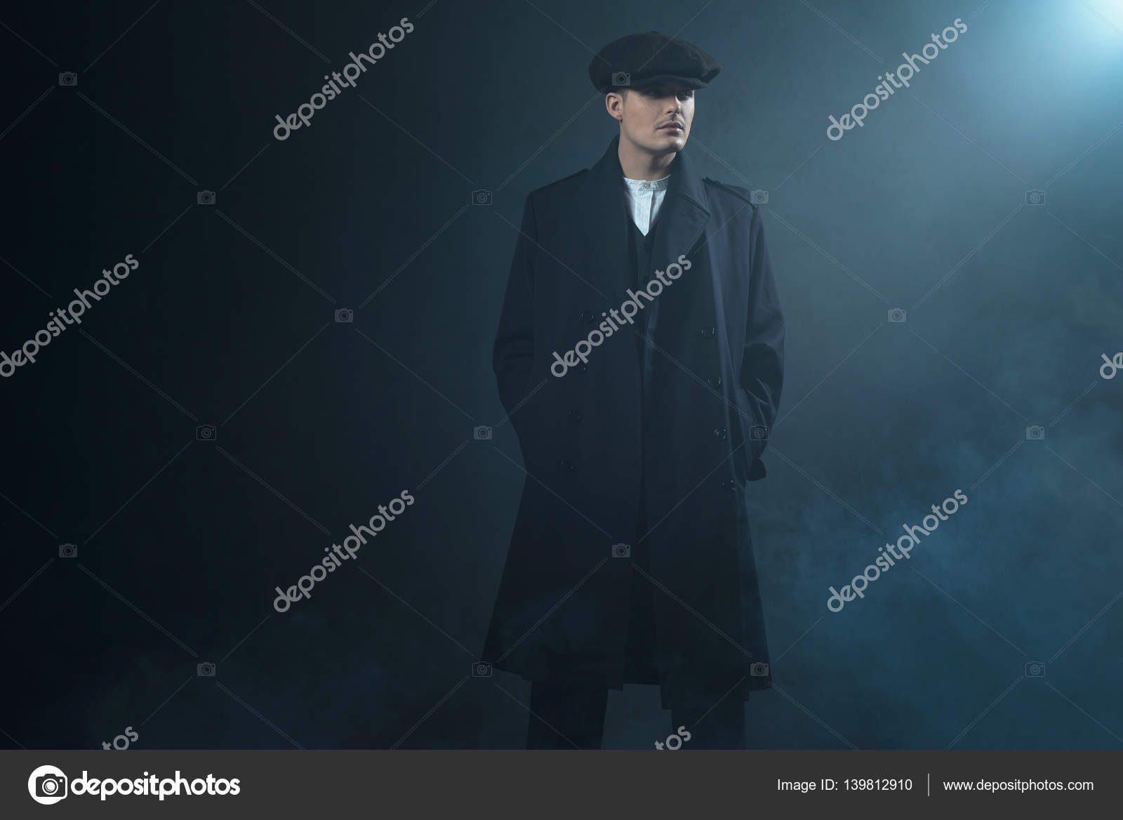 Gangster in flat cap in smoky room. Stock Photo by ©ysbrand 139812910