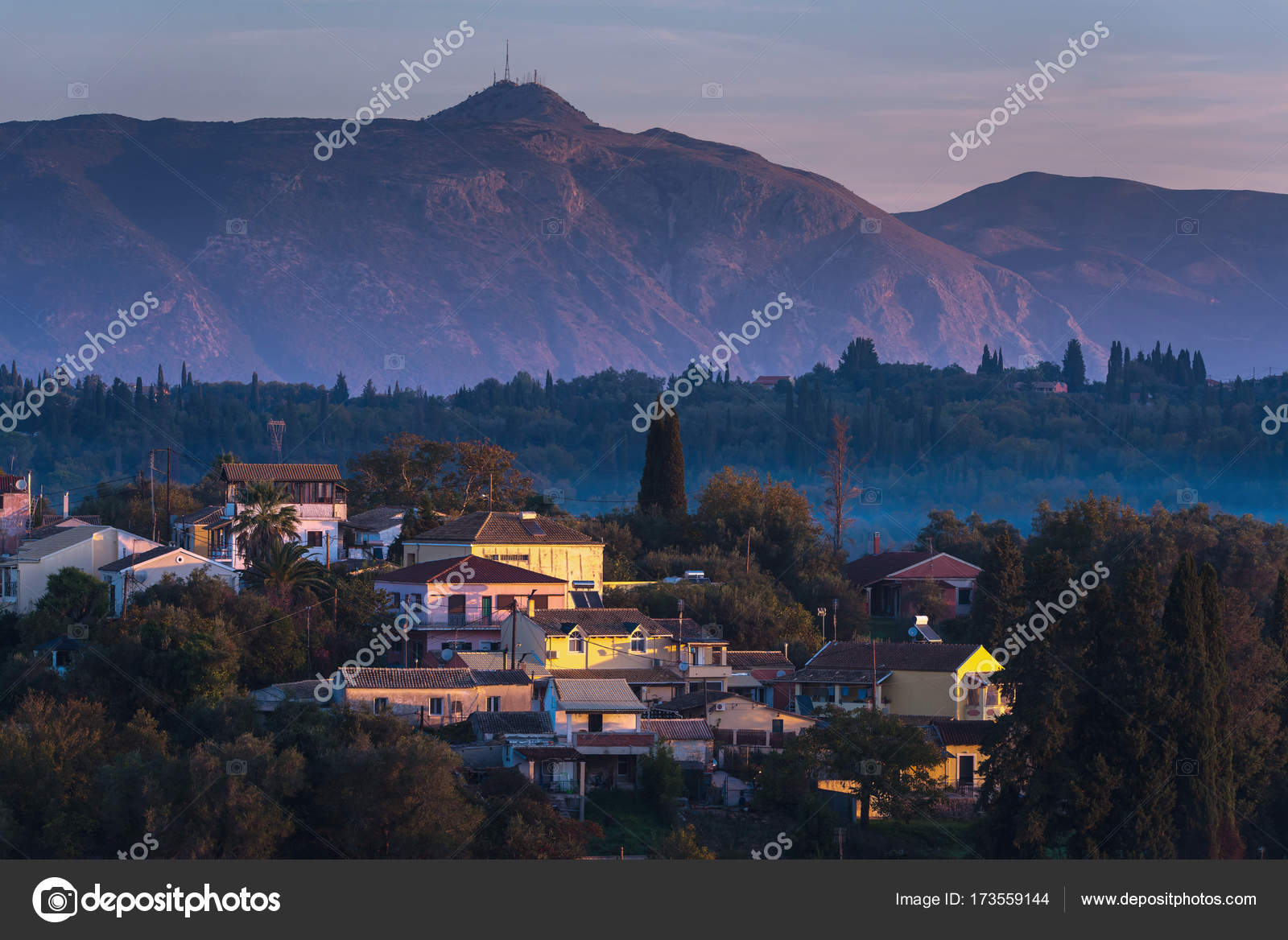 Village in misty hills Stock Photo by ©ysbrand 173559144