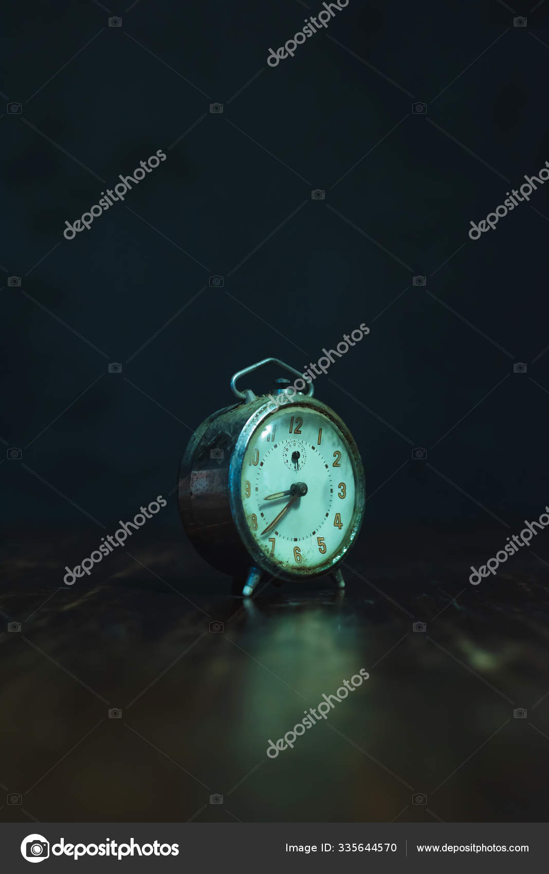 Dusty old alarm clock on worn wooden table. — Stock Photo © ysbrand ...