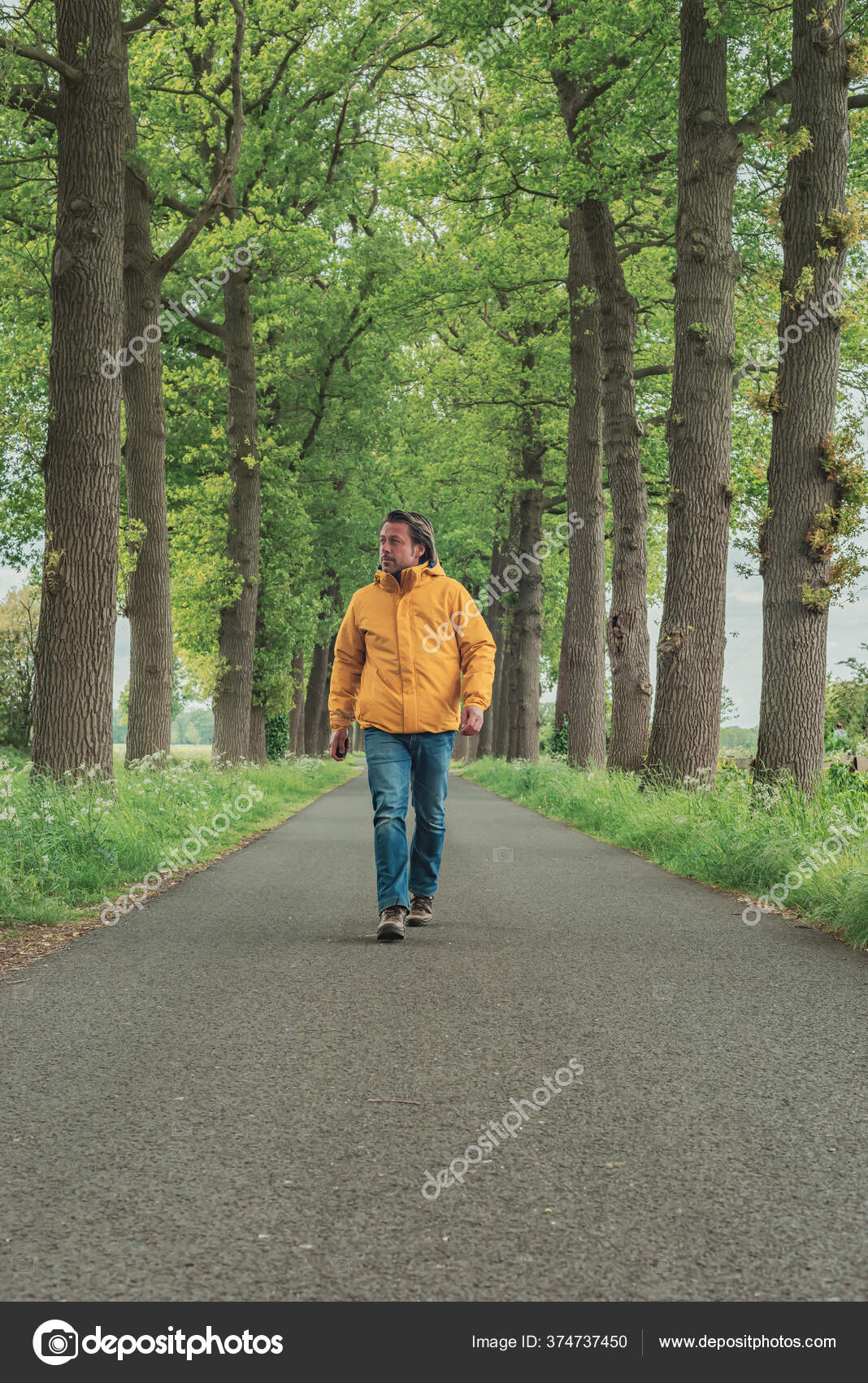 Man Yellow Jacket Jeans Walks Country Road Springtime — Stock Photo ...