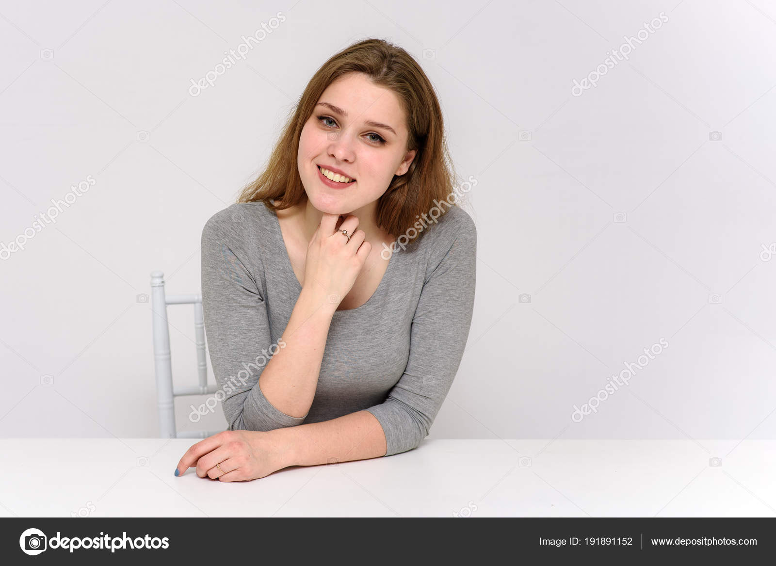 Beautiful Girl Sitting Table Stock Photo by ©govorkov.photo 191891152
