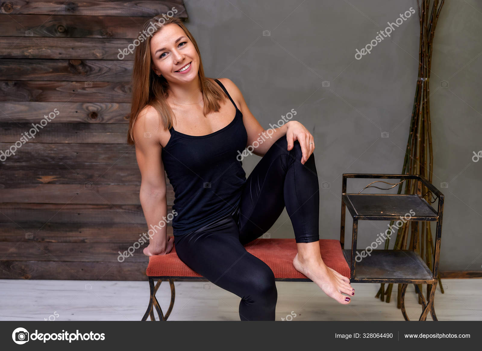 Portrait Of A Pretty Fitness Blonde Girl In A Tracksuit On An