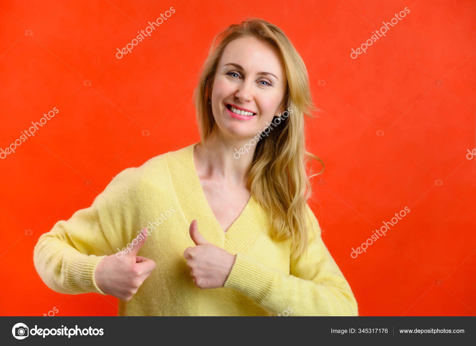 Pretty blonde 40 years old in a yellow sweater shows ok fingers ...