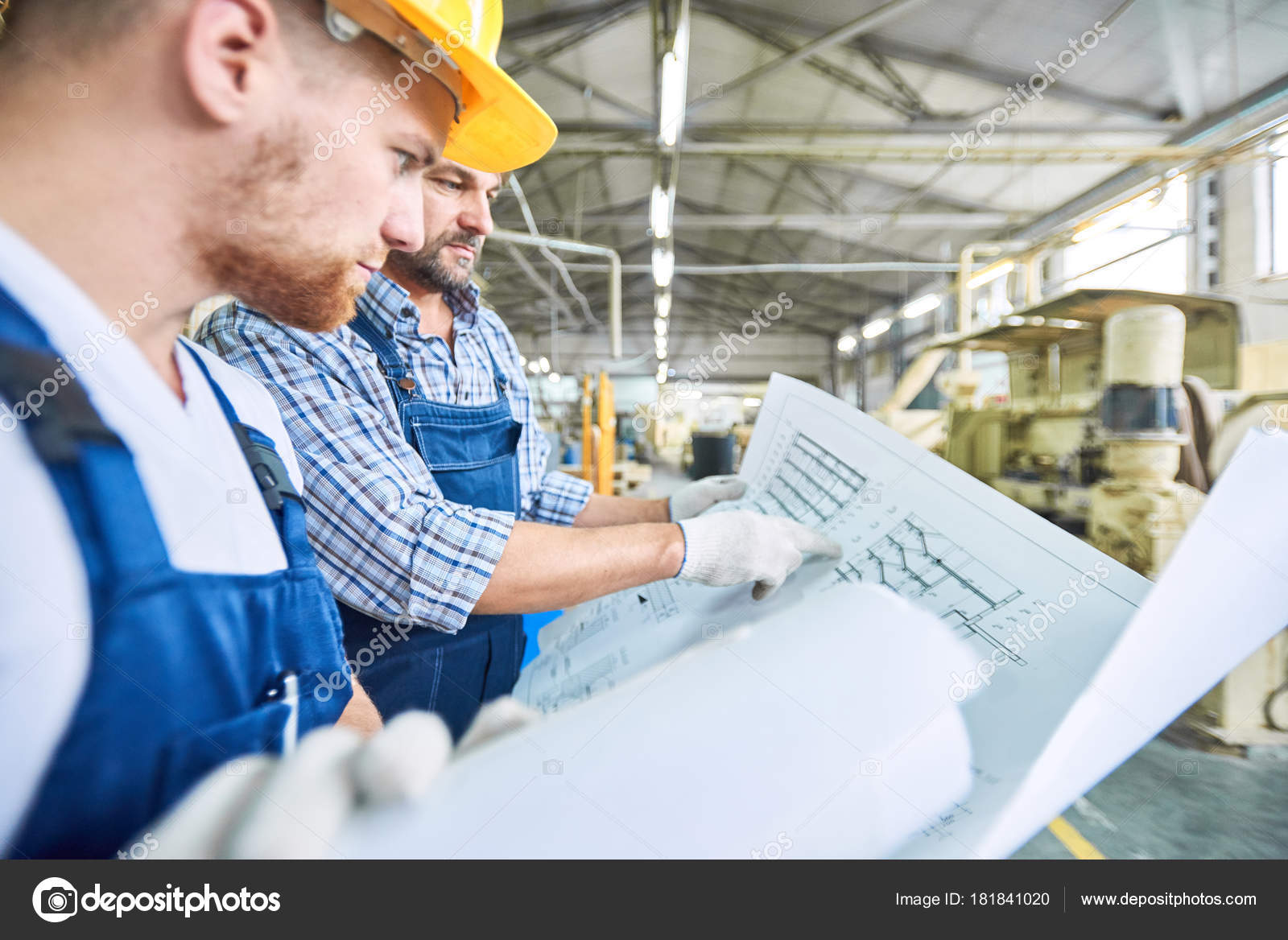 Side View Portrait Two Construction Workers Wearing Hardhats Holding ...