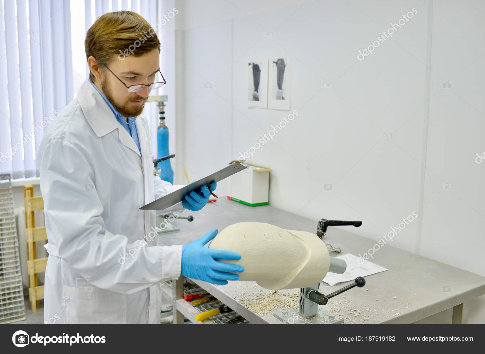 Portrait Young Prosthetic's Technician Checking Prosthesis Molds ...