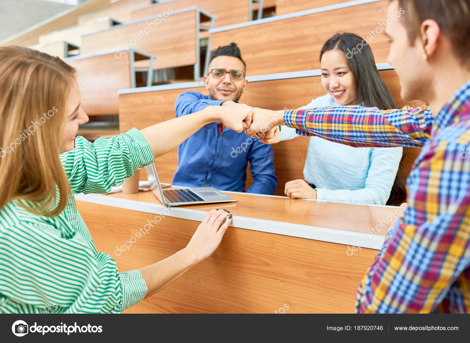 Group Cheerful Students Teaming Bumping Fists Modern College Auditorium ...