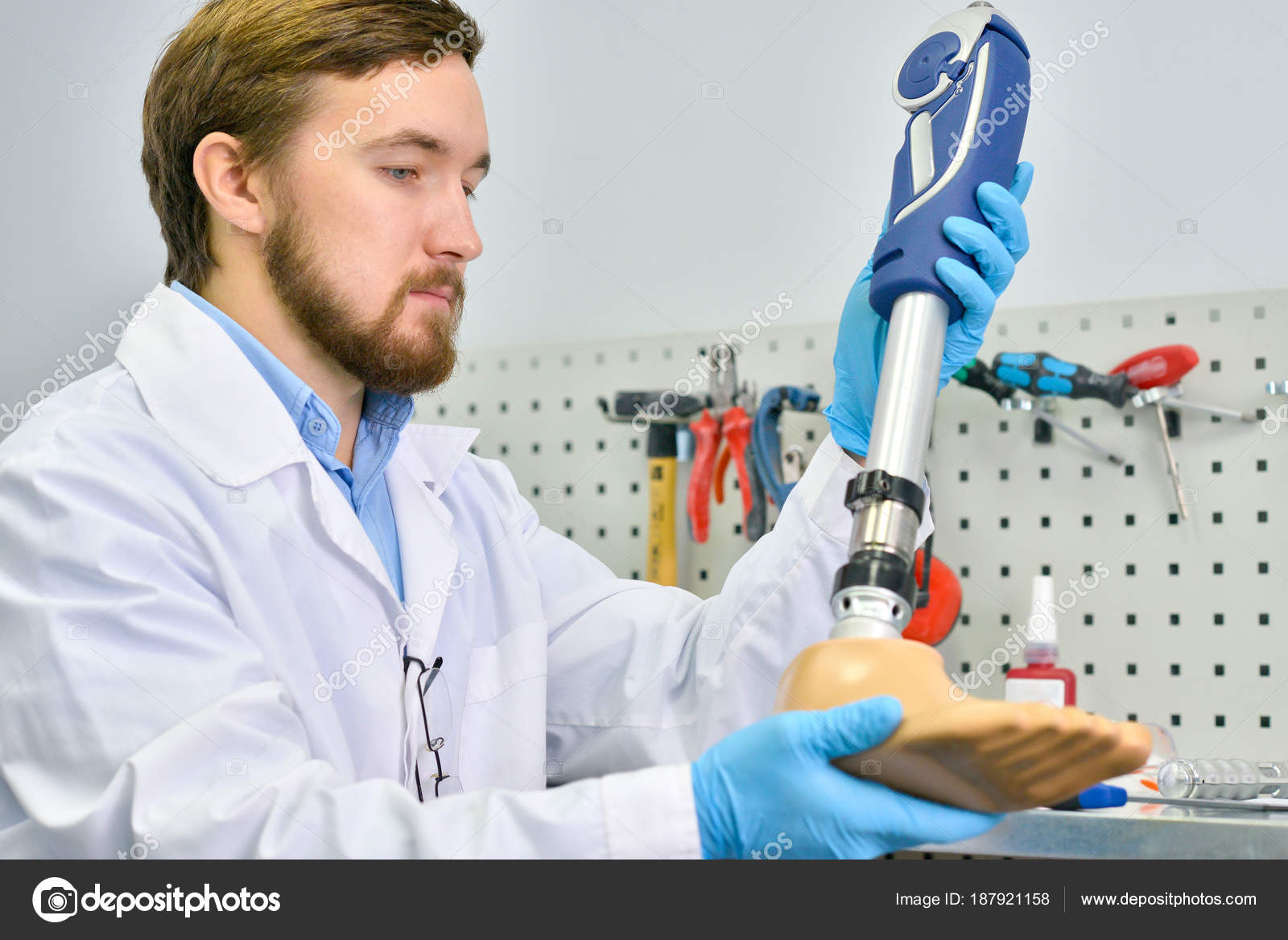 Portrait Young Prosthetist Holding Prosthetic Leg Checking Quality ...