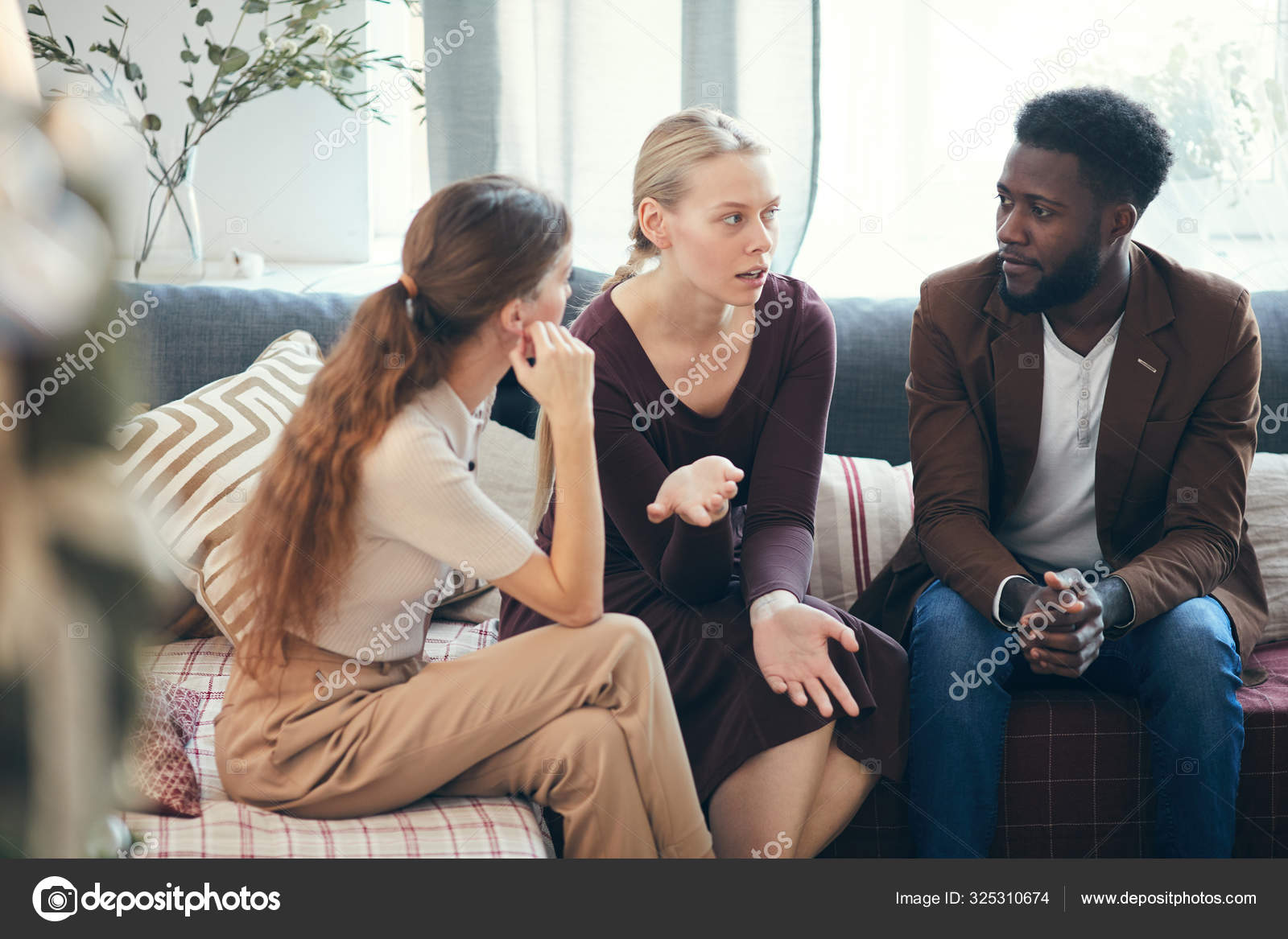 Group Modern Young People Talking Each Other While Sitting Cozy Stock ...