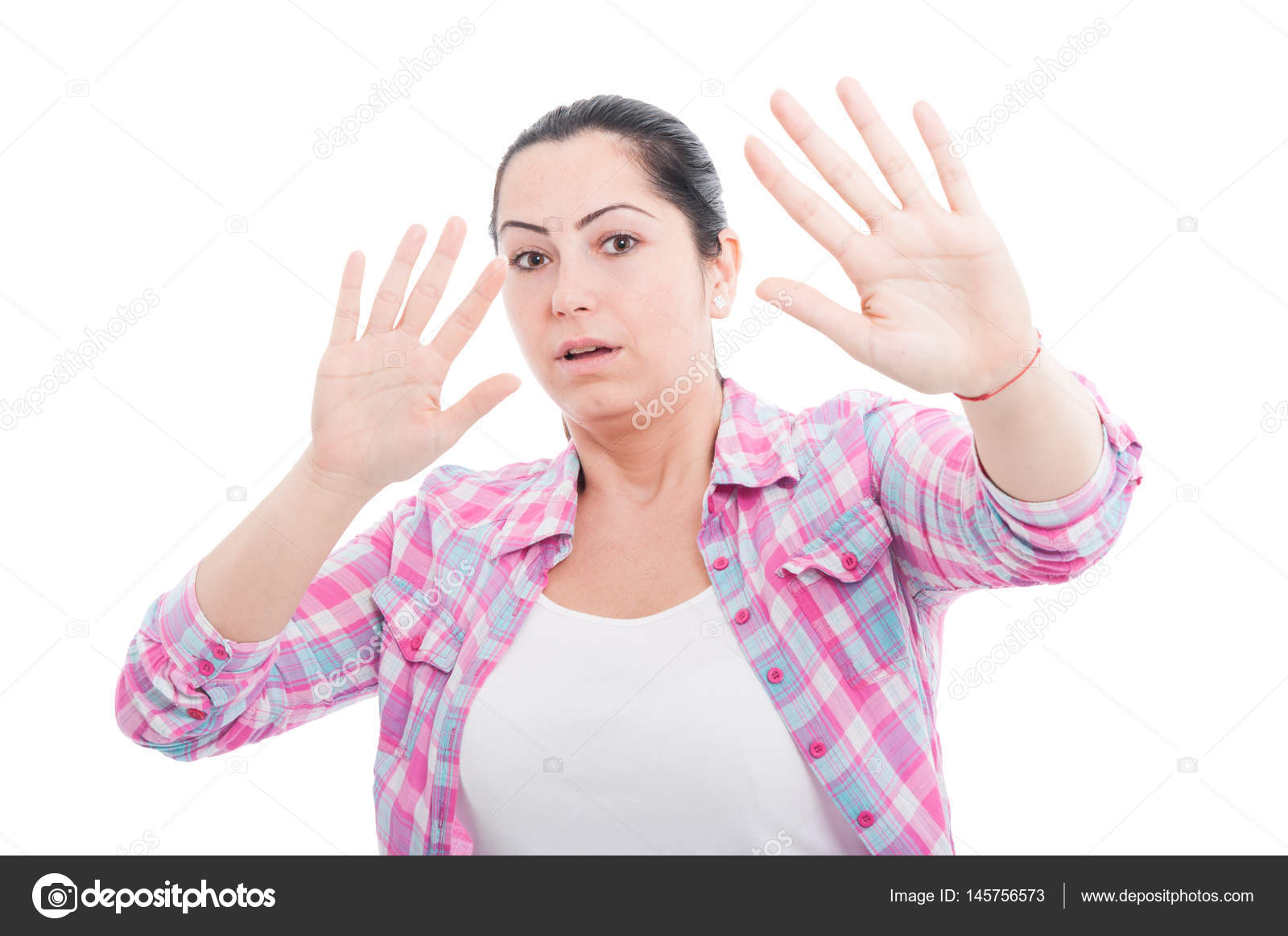 Scared woman raising hands up in defense — Stock Photo © catalin205 ...