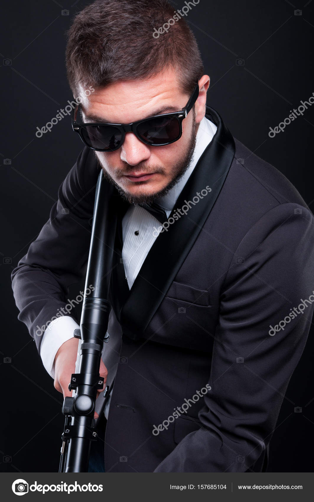 Mafia guy with armed rifle preparing to shoot — Stock Photo ...