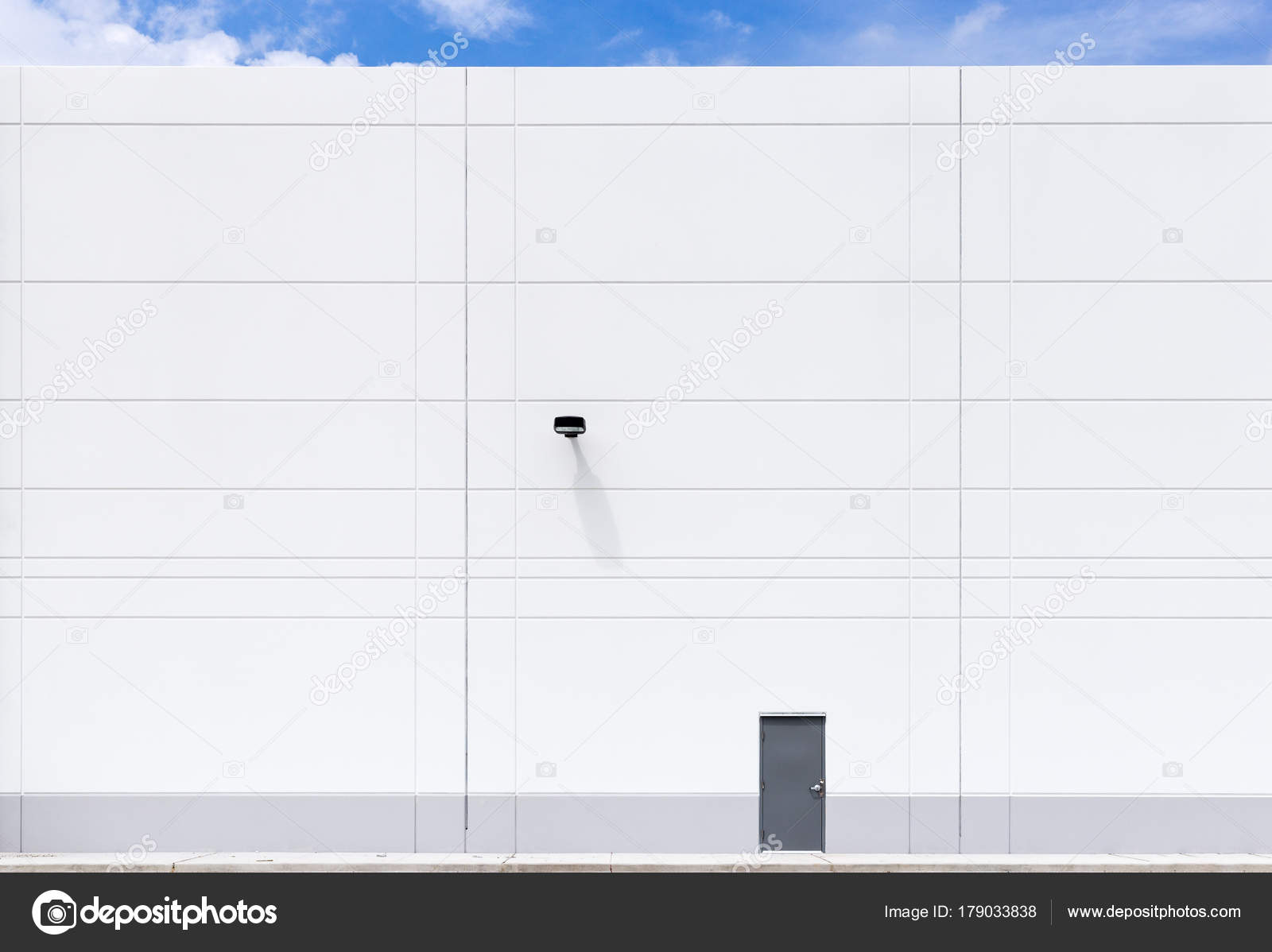 New construction warehouse white walls gray metal black door lig Stock ...