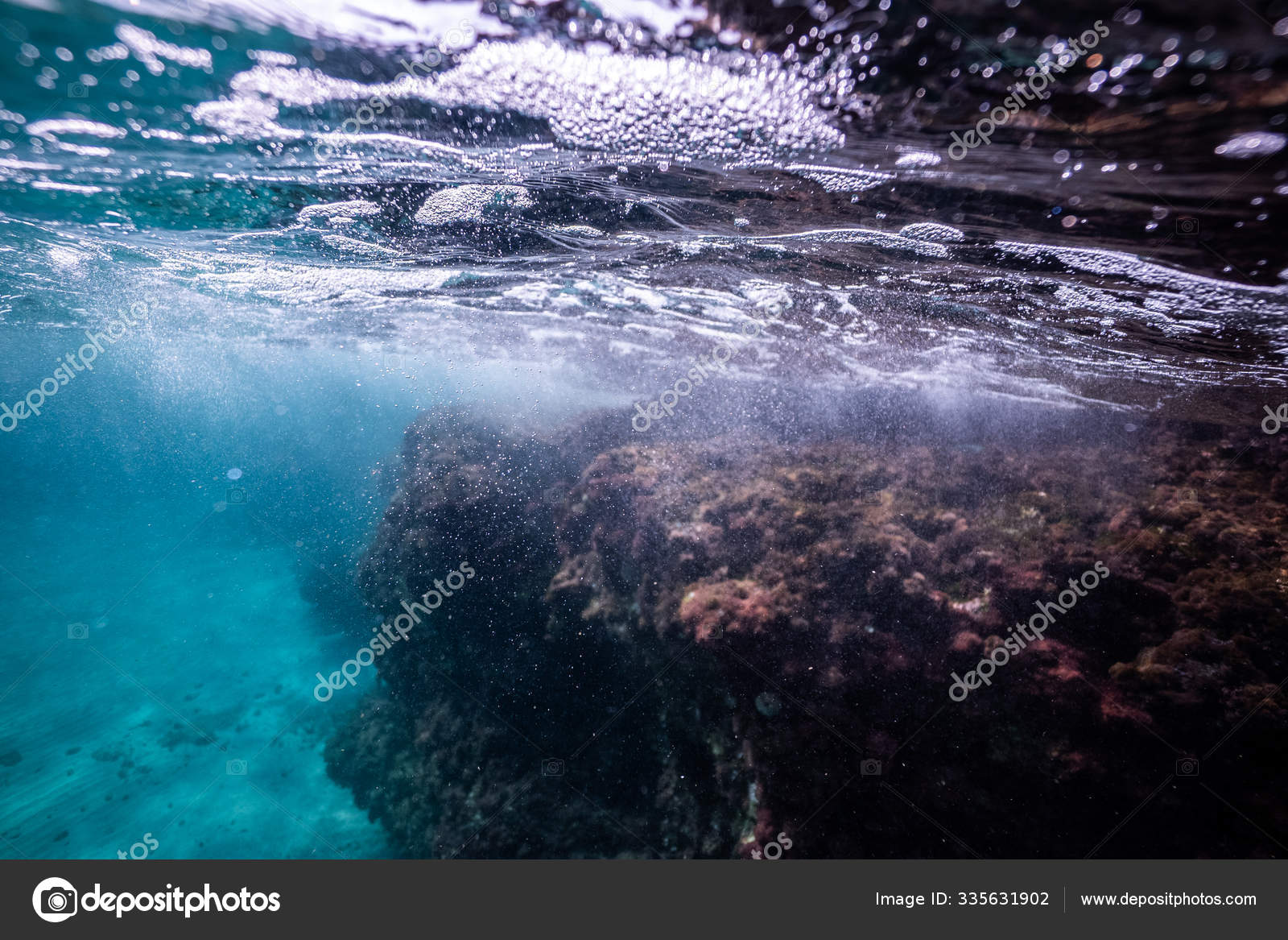 Half over half underwater shot on a beautiful bay in Palma de Mallorca ...