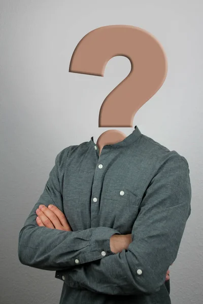 man in a gray shirt with question mark instead of head, concept of ...
