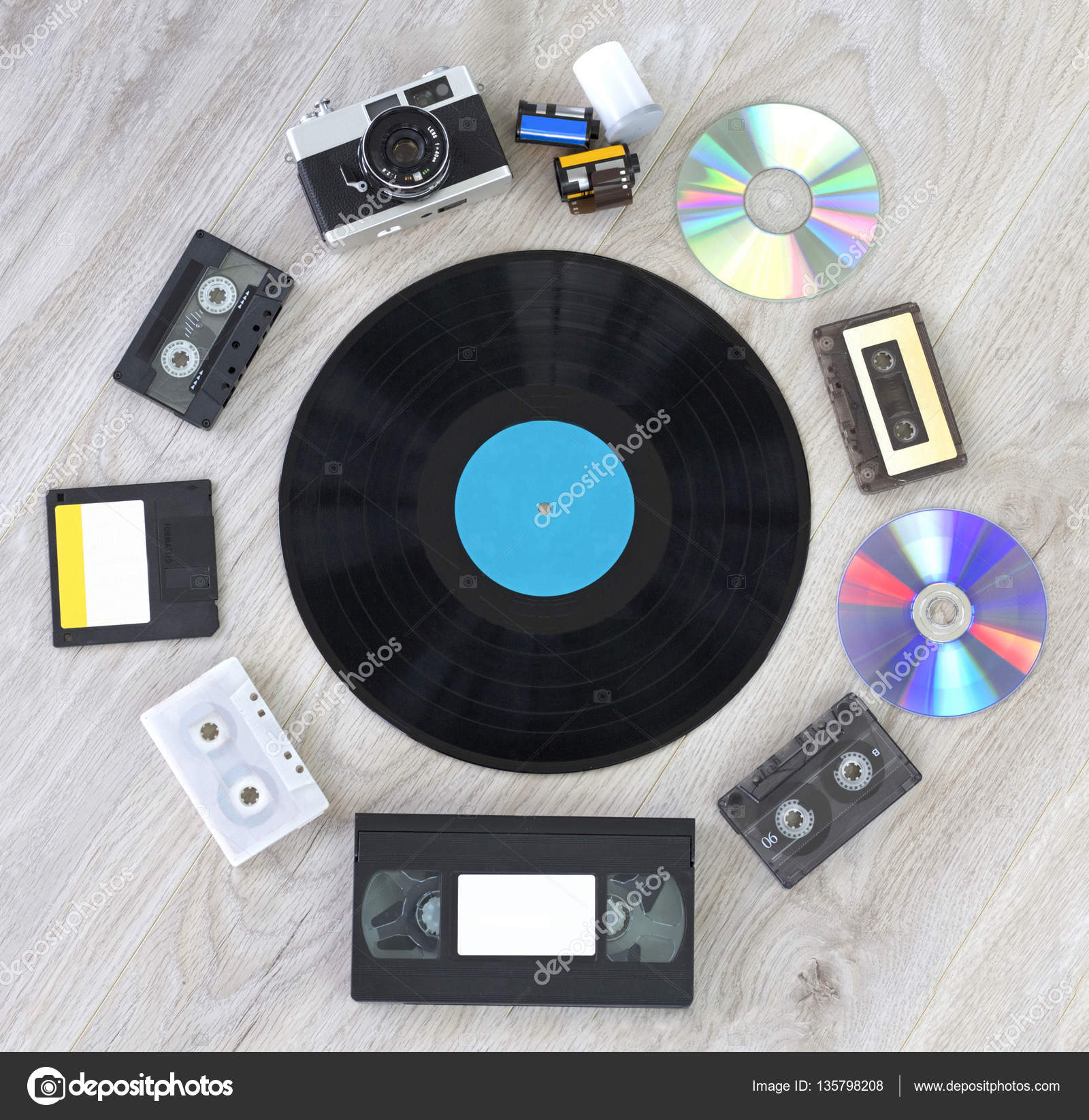 Various retro things. Camera, film, vinyl record disc, audio cassette ...