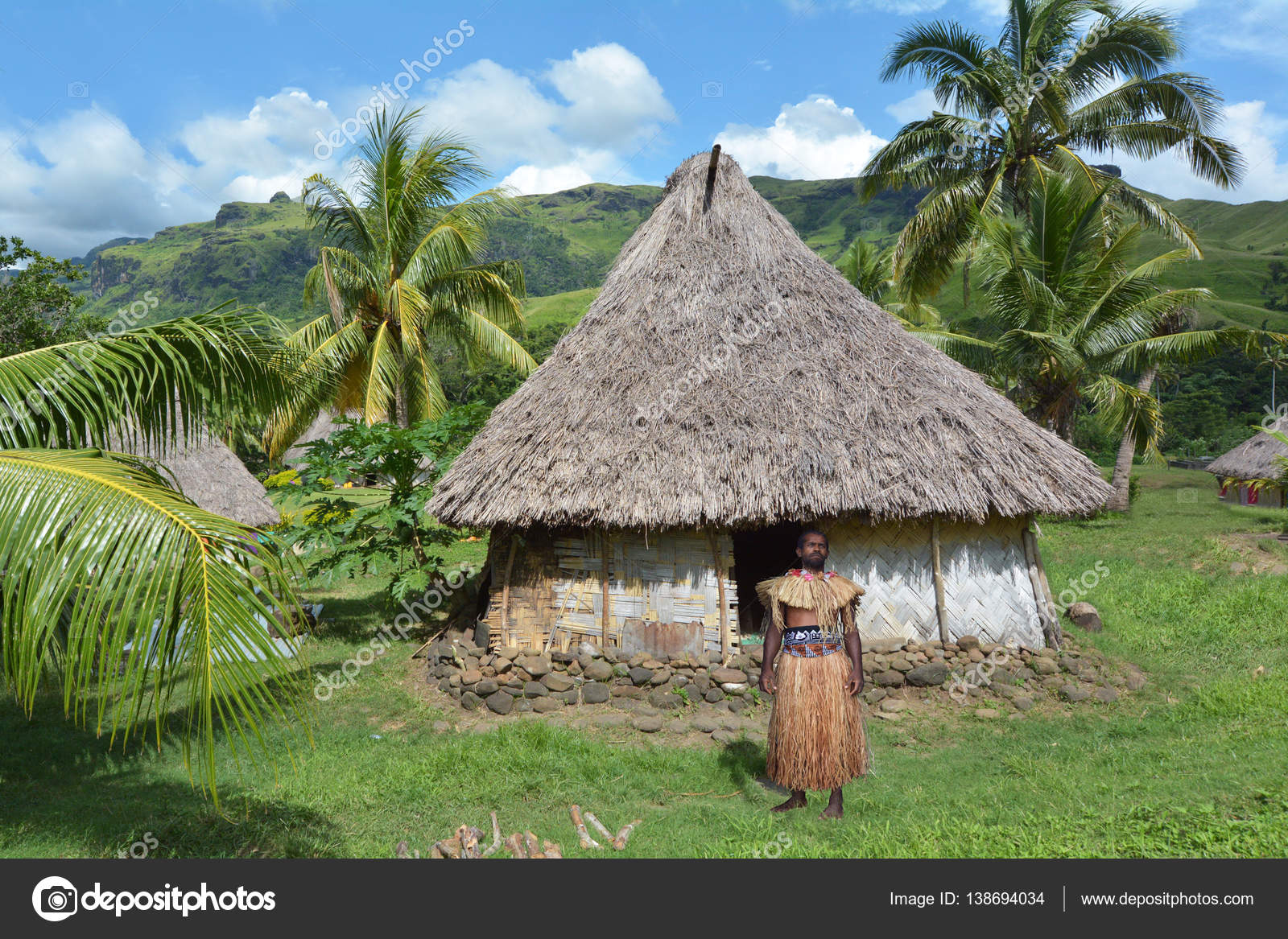 Indigenous Fijian man dressed in traditional Fijian costume, sta ...