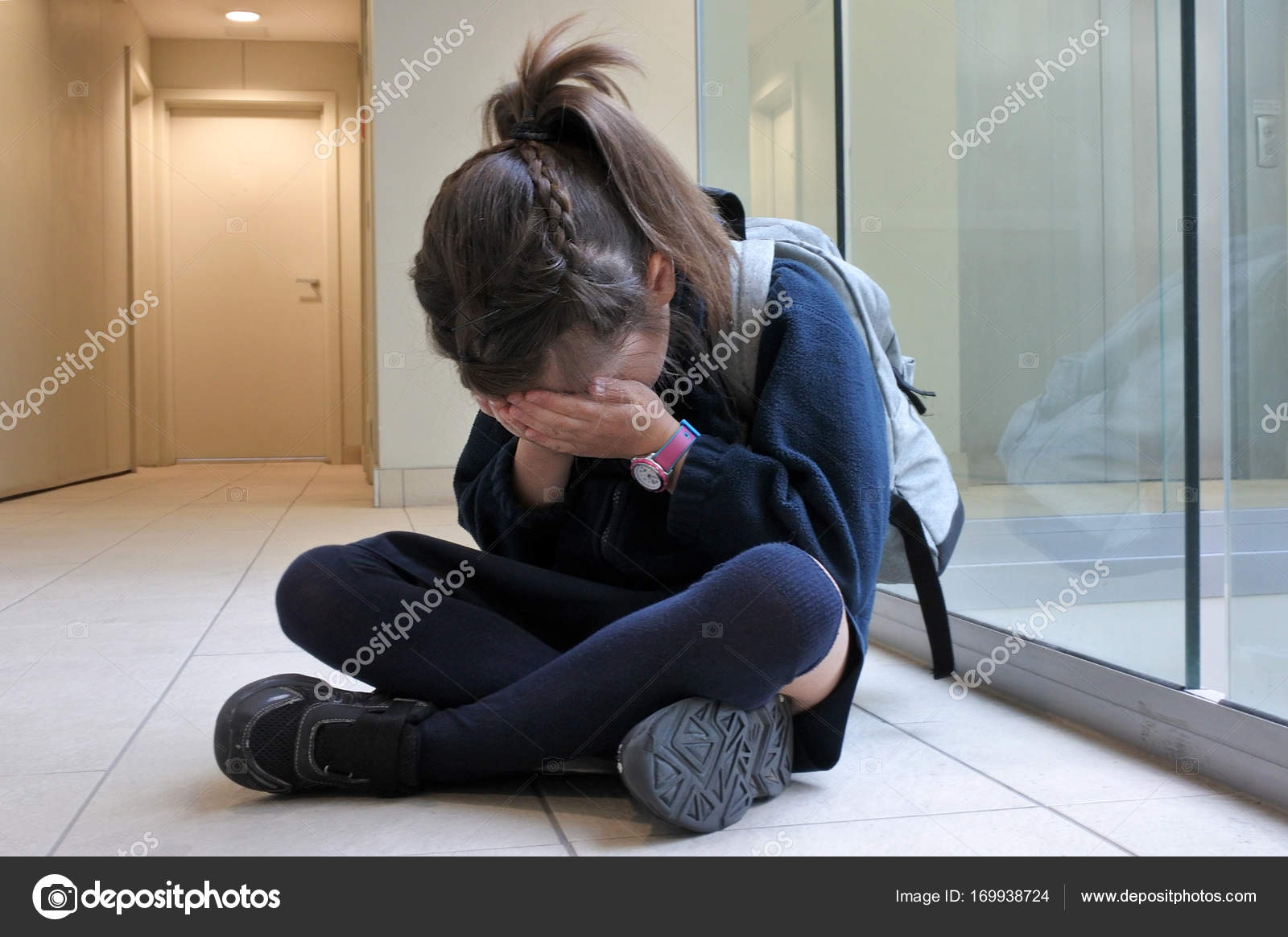 Young elementary school girl crying Stock Photo by ©lucidwaters 169938724