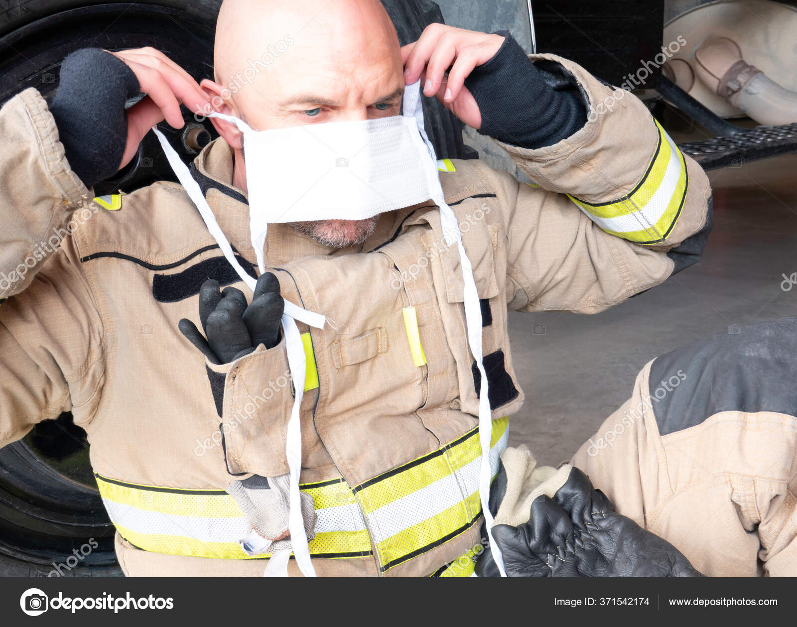 Firefighter Wears Mask Protect Himself Covid Stock Photo by ©Maestock ...