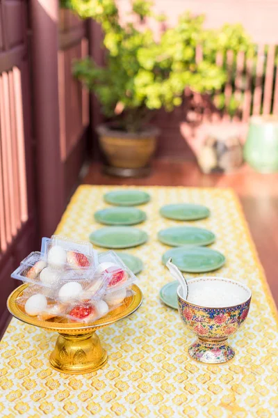 Offer food to monk. Groom give alms food to a Buddhist monk in ...