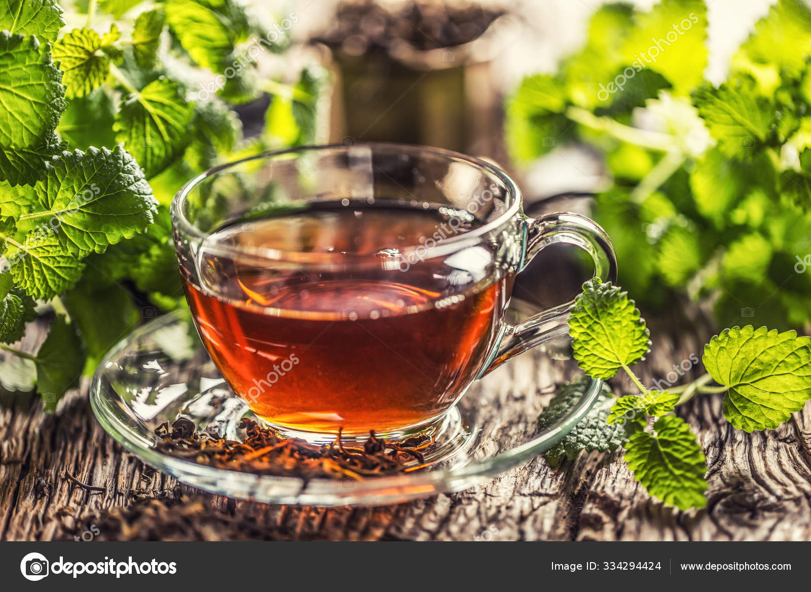 A cup of melissa tea with herbs on wooden table Stock Photo by ©weyo ...
