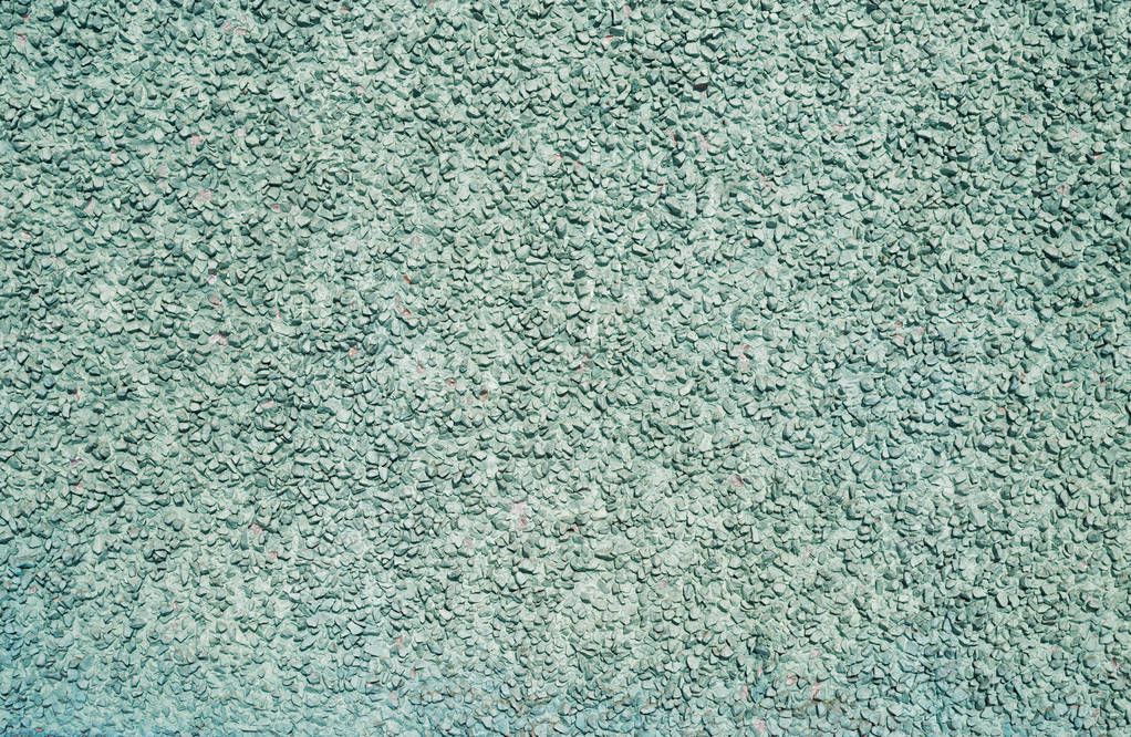 La textura de la superficie enlucida con una fina grava de color gris ...