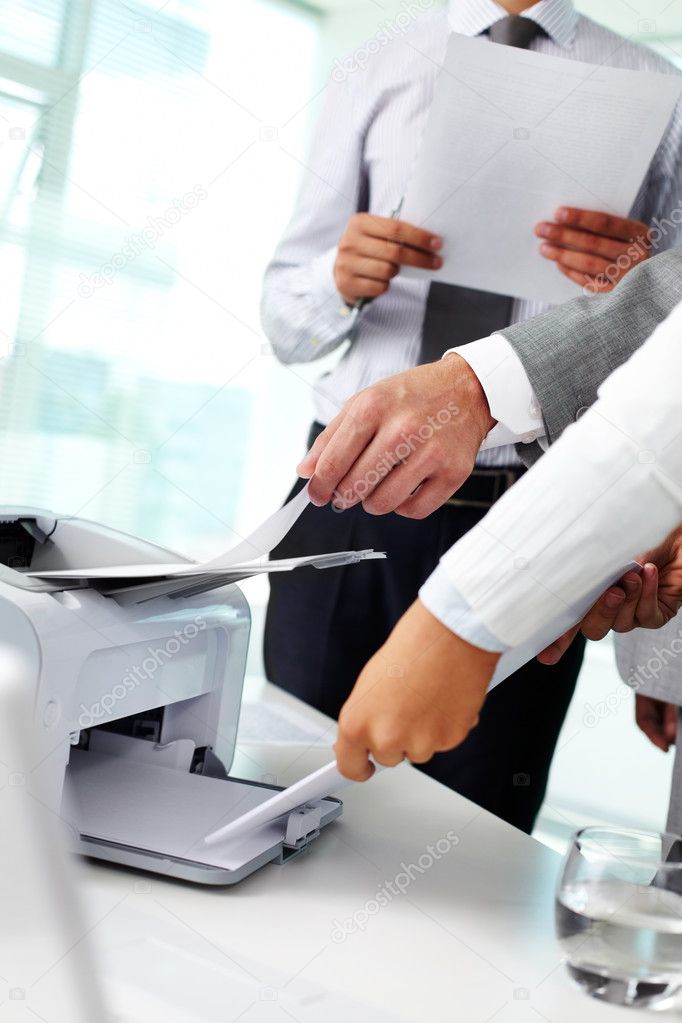 Hands taking documents from printer — Stock Photo © pressmaster #126754986