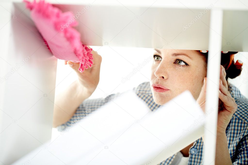 Young woman cleaning table with duster Stock Photo by ©pressmaster ...